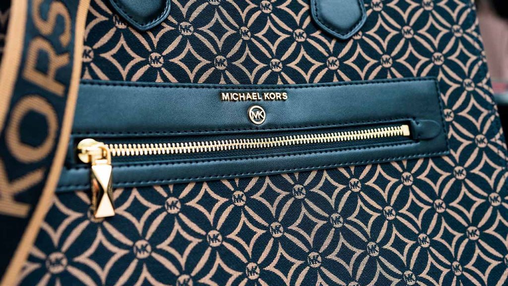 A Origem da Marca MK: Quando e Onde surgiu a Michael Kors? - Etiqueta Unica